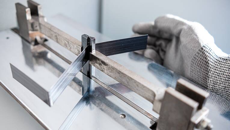 Bainitically hardened and tempered steel strip for cutting and stamping ...